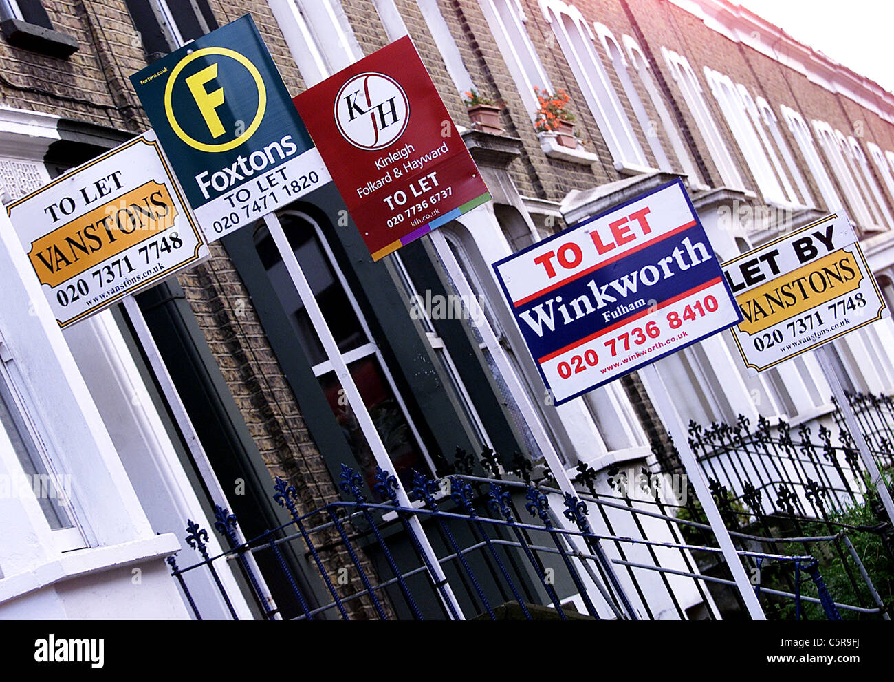 Various To Let boards on one street in Fulham, London Stock Photo - Alamy