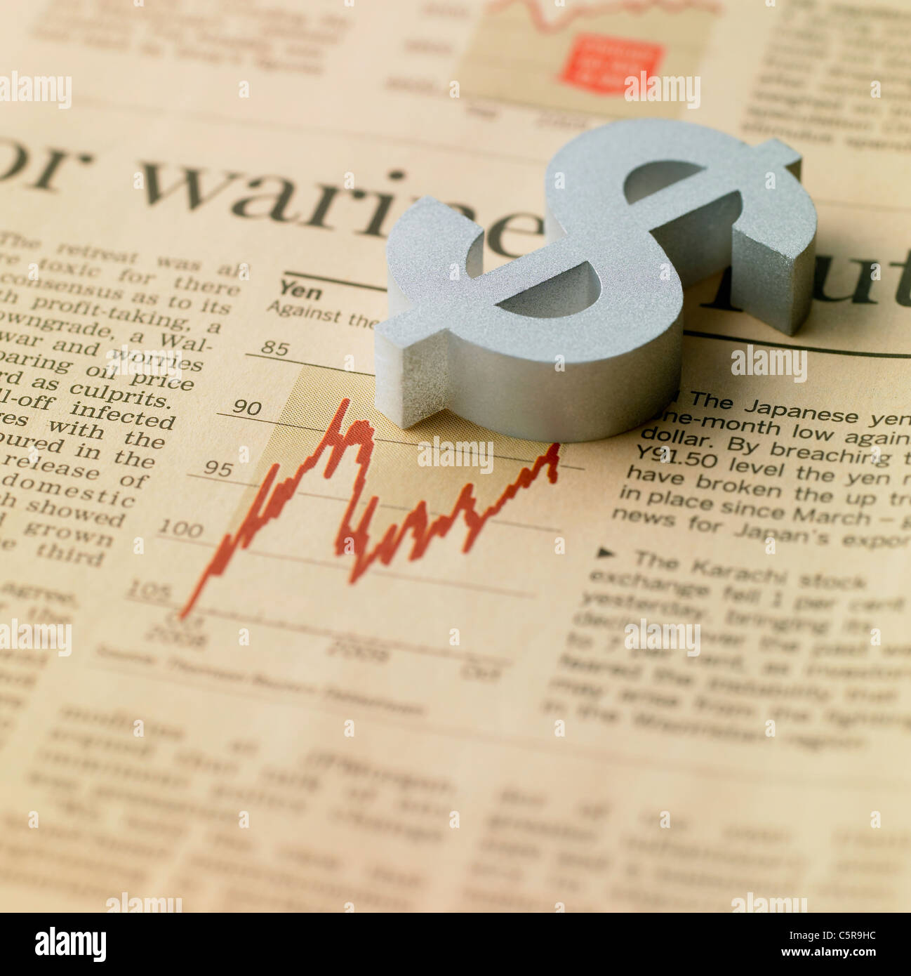 A dollar sign on a newspaper Stock Photo - Alamy