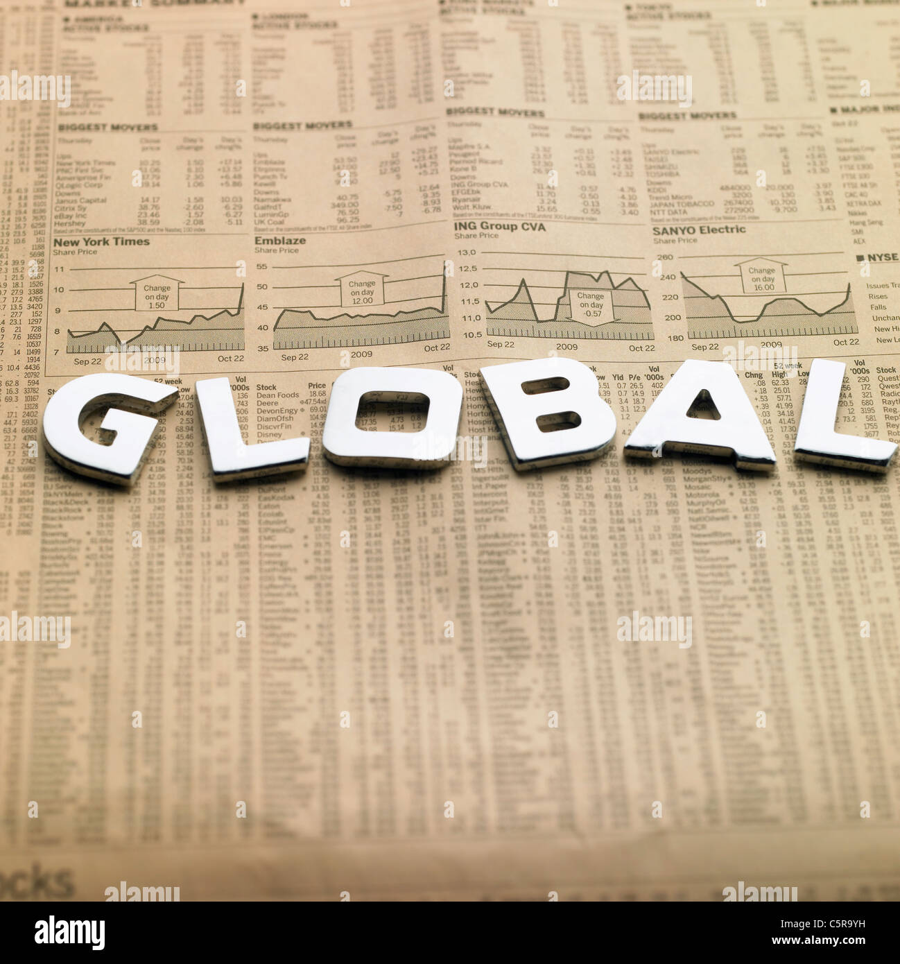 Alphabet letters on newspaper Stock Photo - Alamy