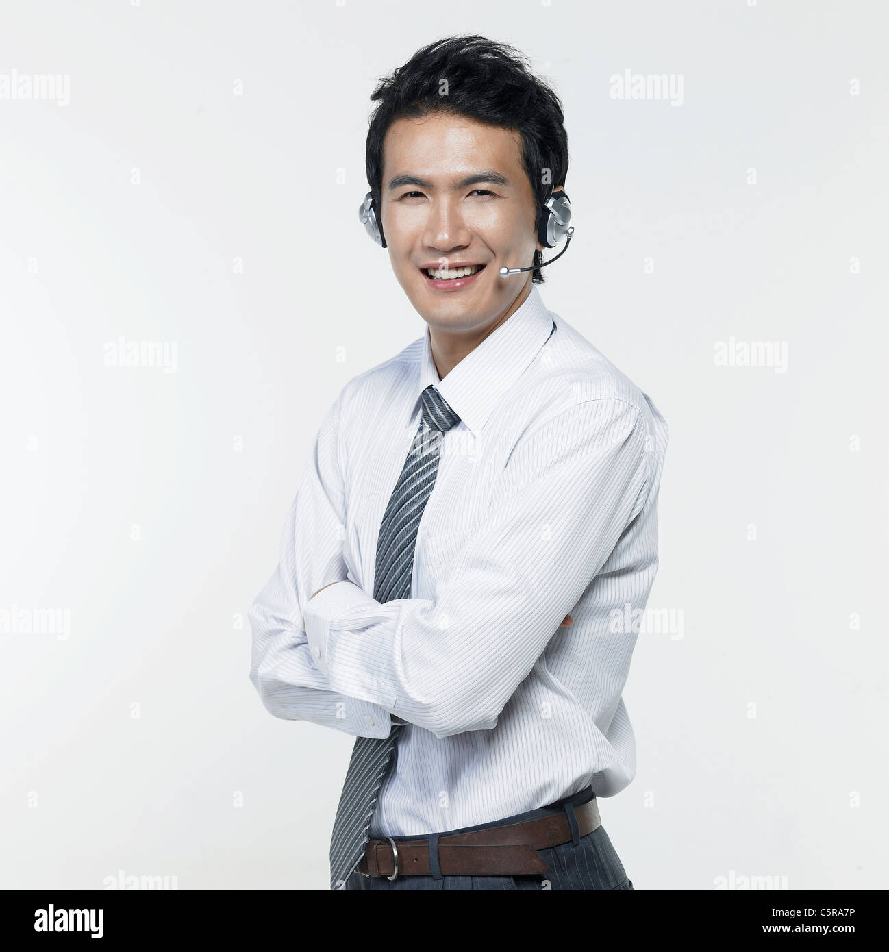A man wearing headset smiling Stock Photo - Alamy