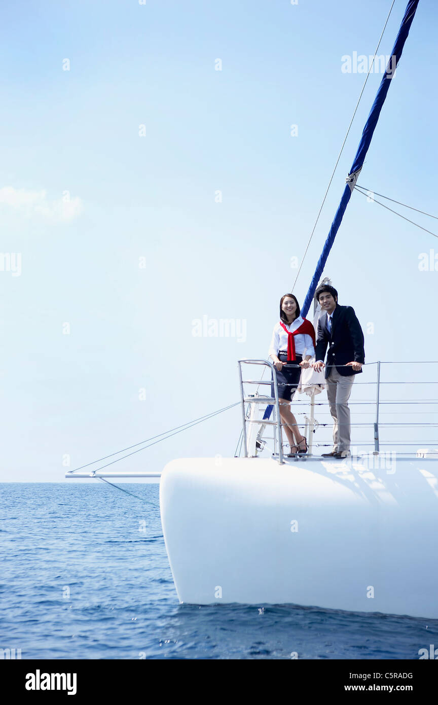 Two people riding a boat Stock Photo - Alamy