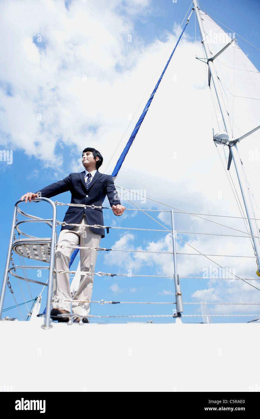 A man standing on a boat Stock Photo - Alamy