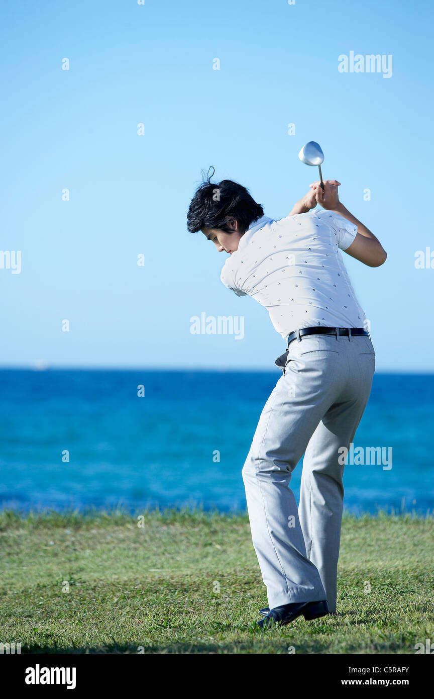 A man playing golf Stock Photo - Alamy