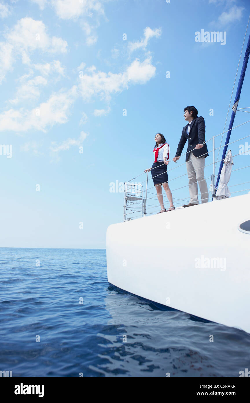 Two people riding a boat Stock Photo - Alamy