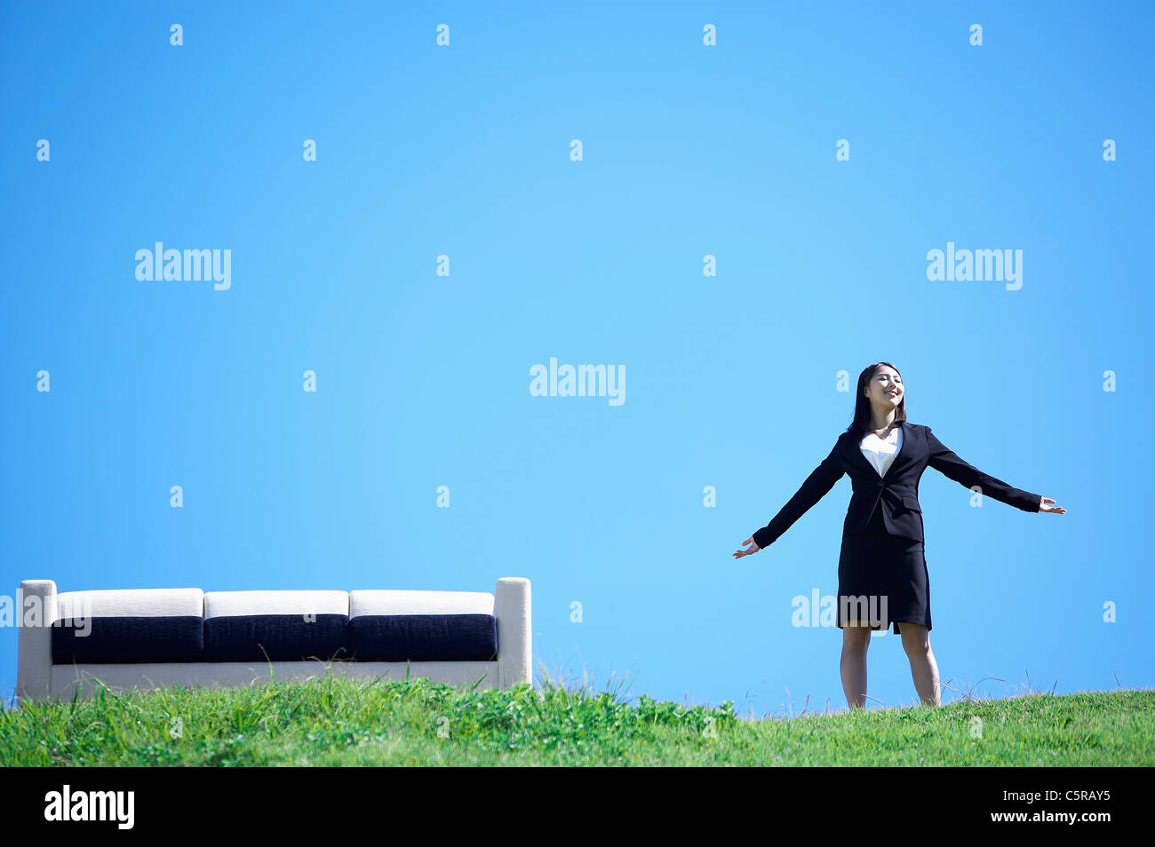 Woman sofa arms out hi-res stock photography and images - Alamy