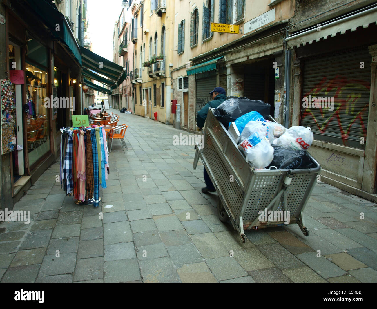 Garbage collector in Venice, Italy Stock Photo - Alamy