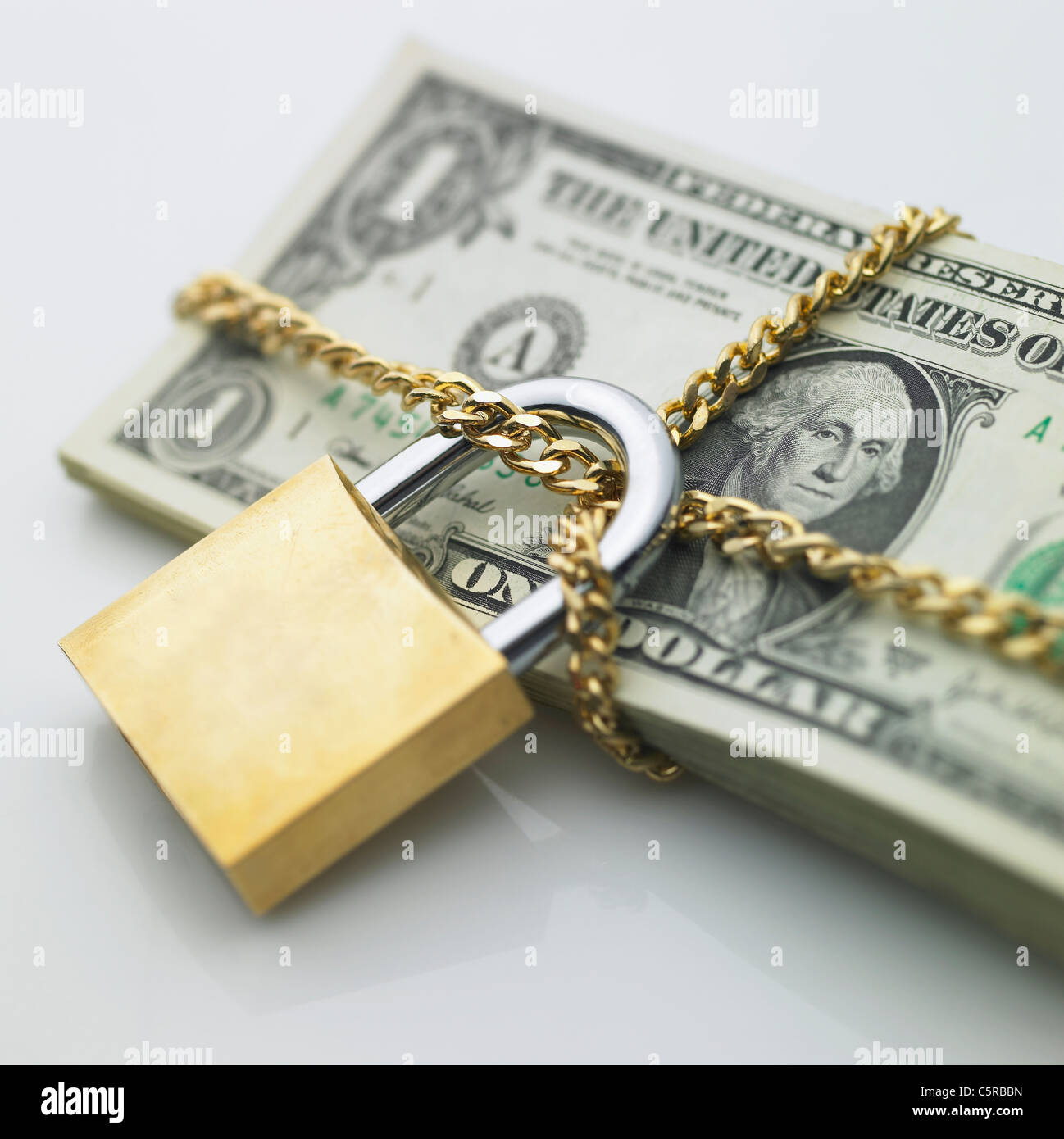 Money and lock hi-res stock photography and images - Alamy