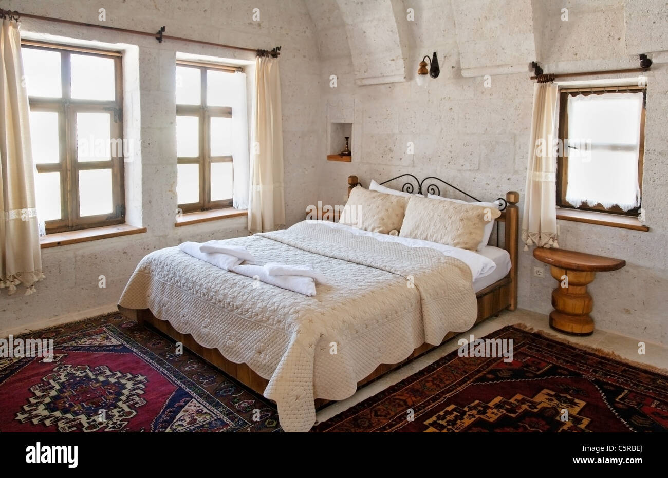 interior detailing of bedroom under the limestone arches, white ...