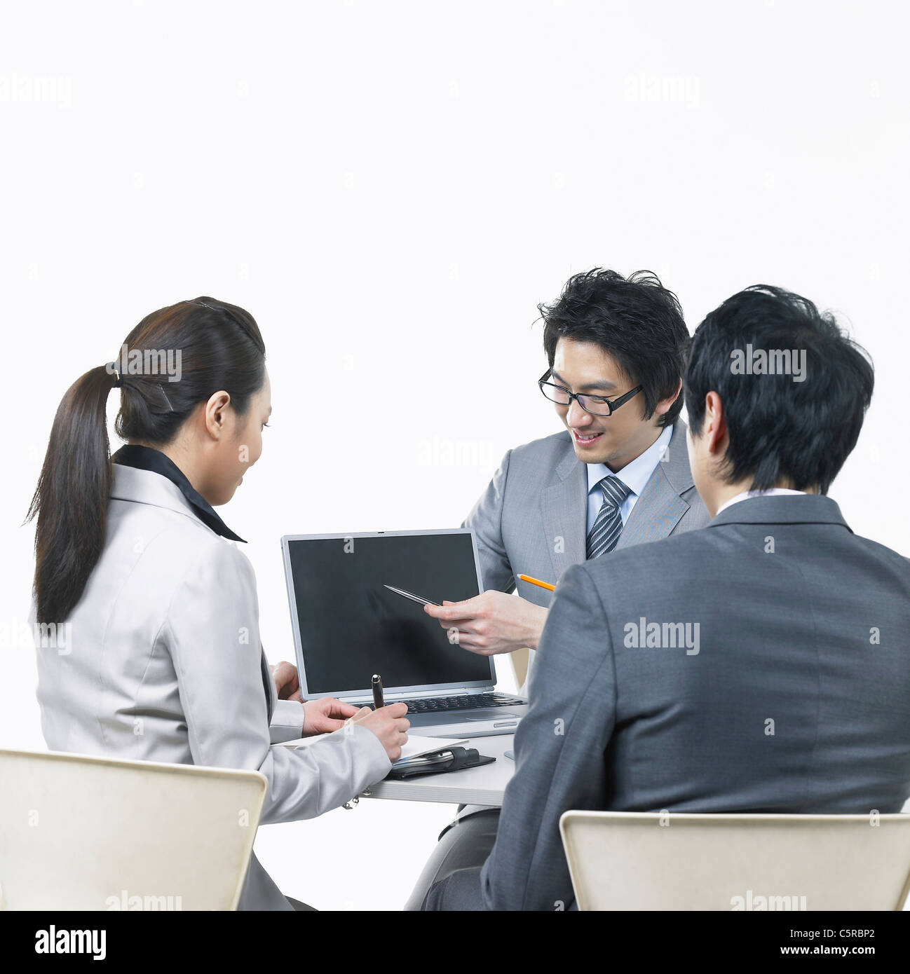 Three people having a meeting Stock Photo - Alamy