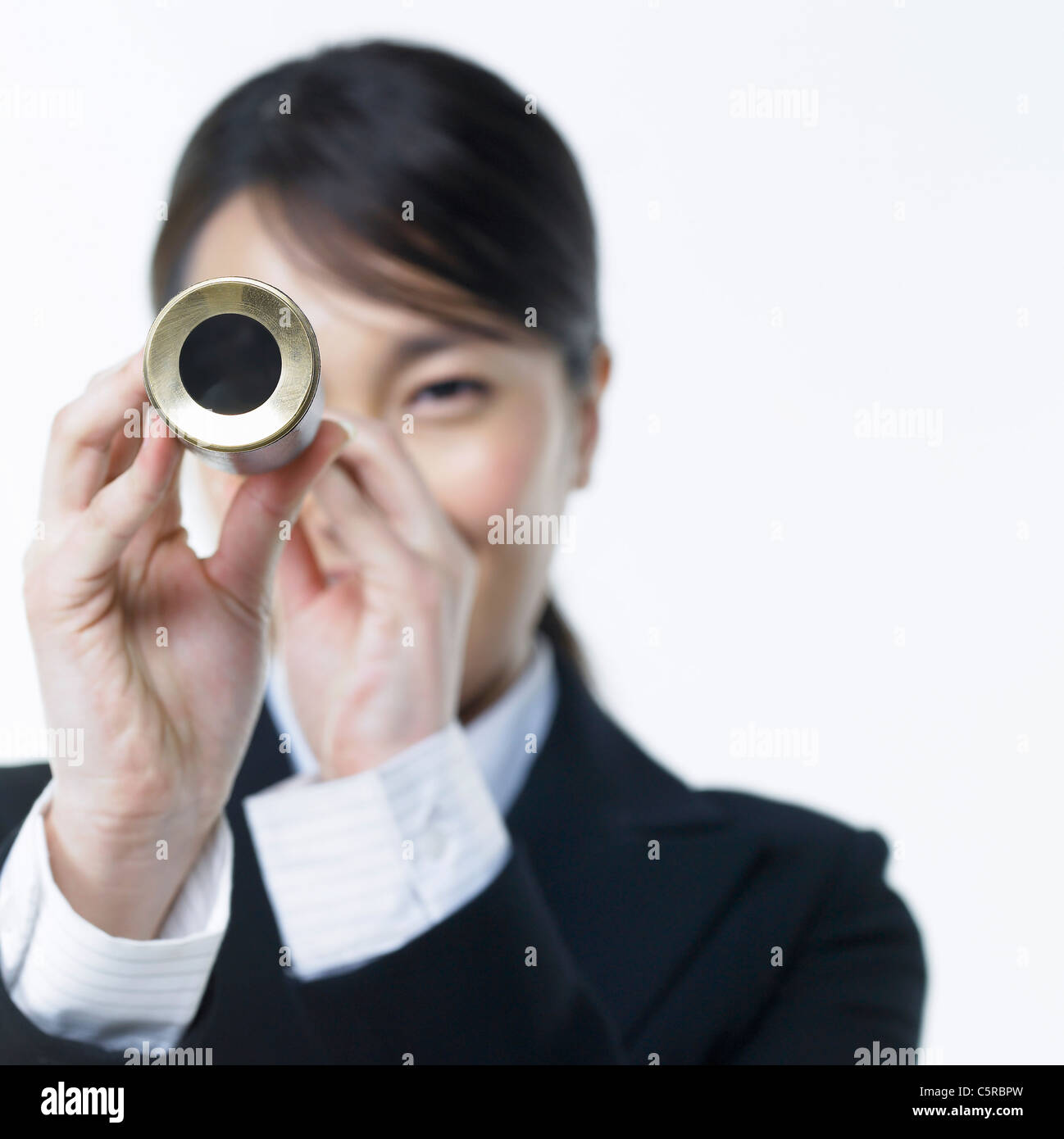A woman looking a telescope Stock Photo - Alamy