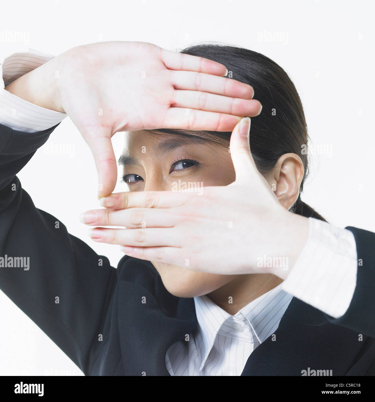 A woman making square with her hands Stock Photo - Alamy