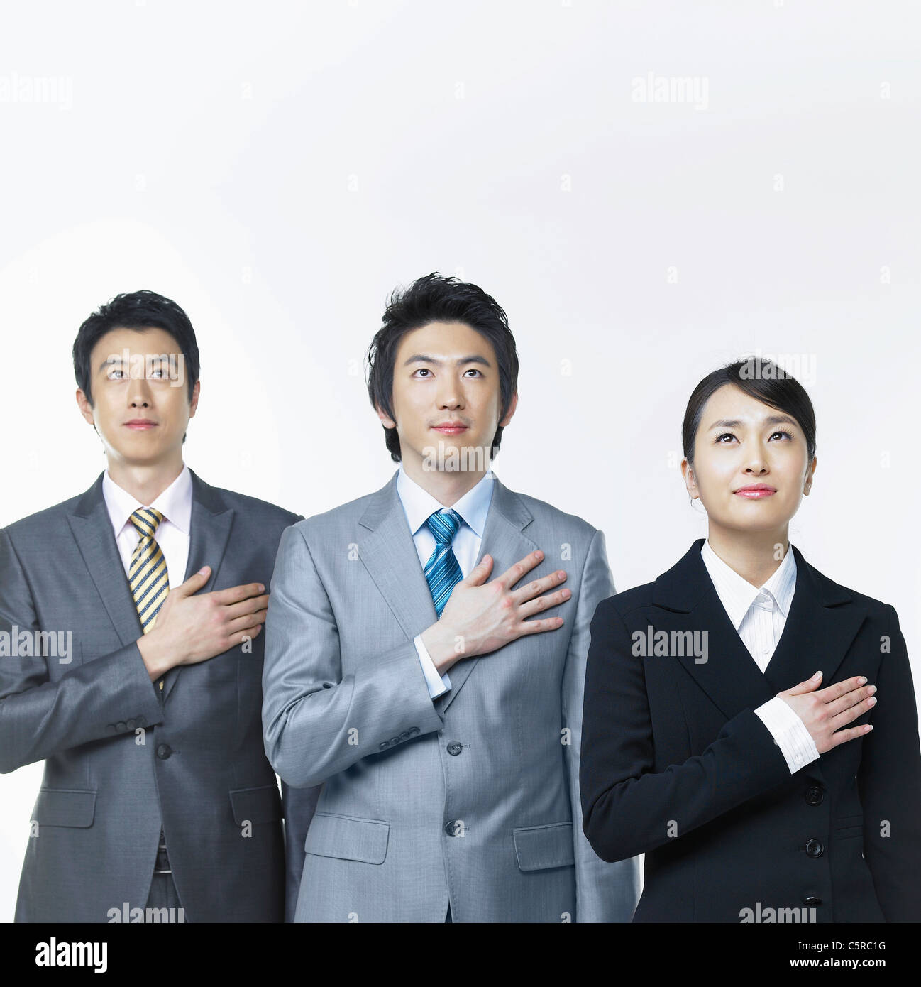 Three people saluting Stock Photo - Alamy