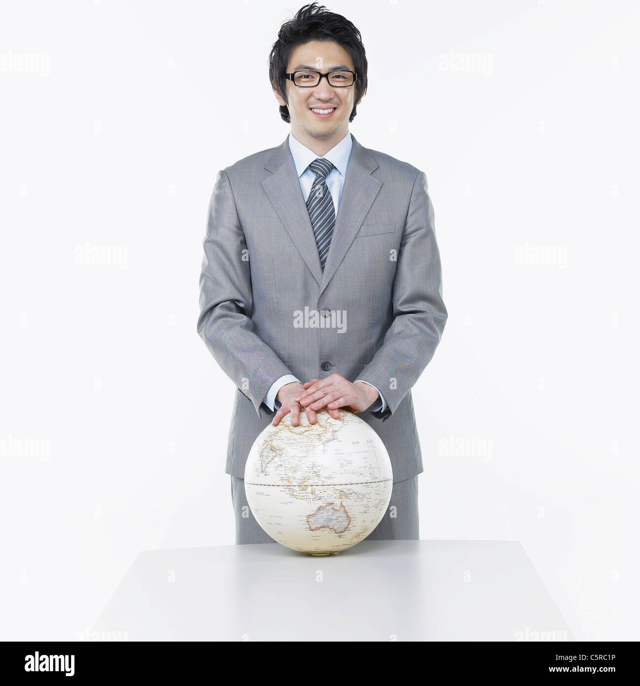 A man holding a globe Stock Photo - Alamy