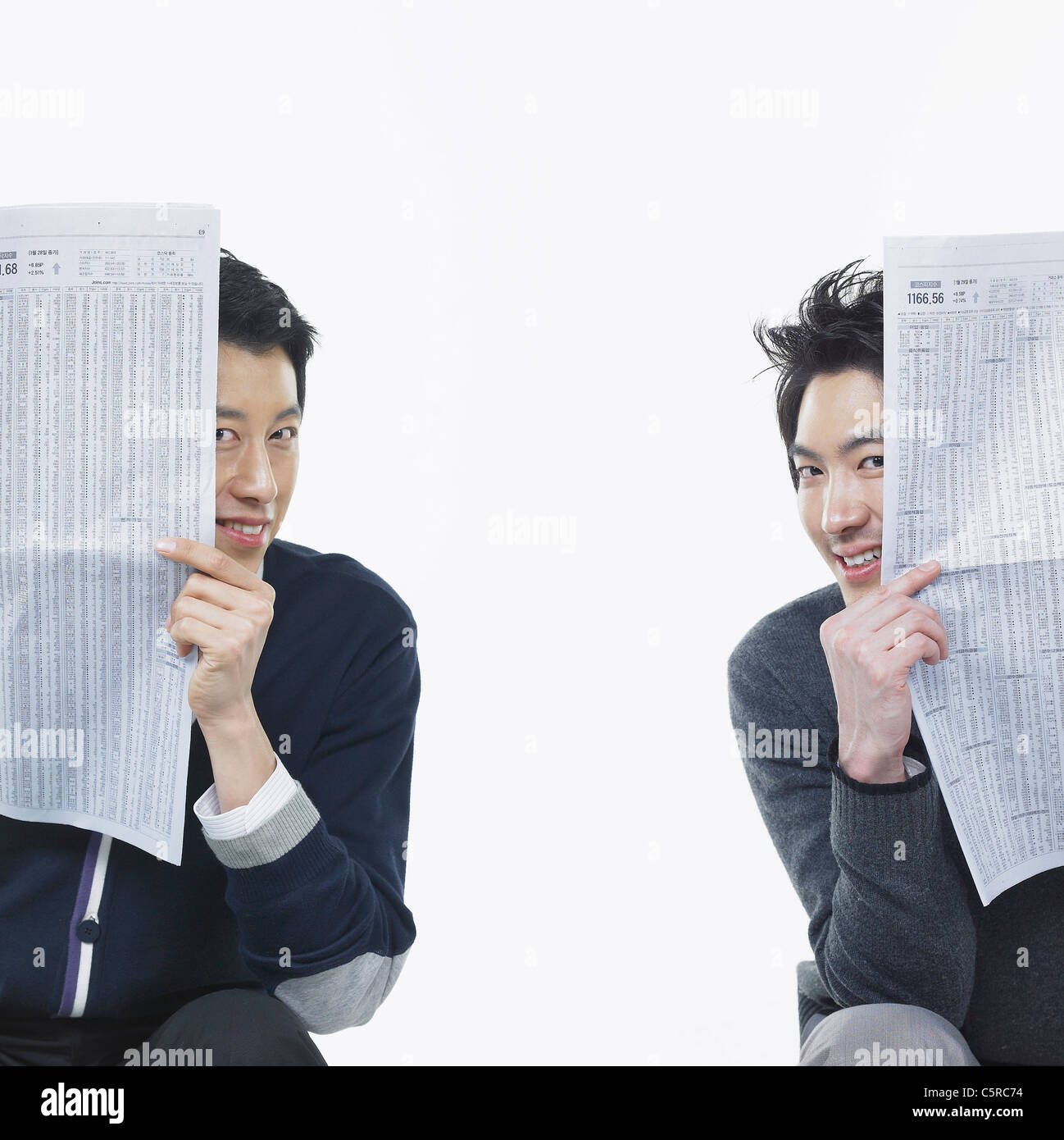 Hiding behind newspaper hi-res stock photography and images - Alamy