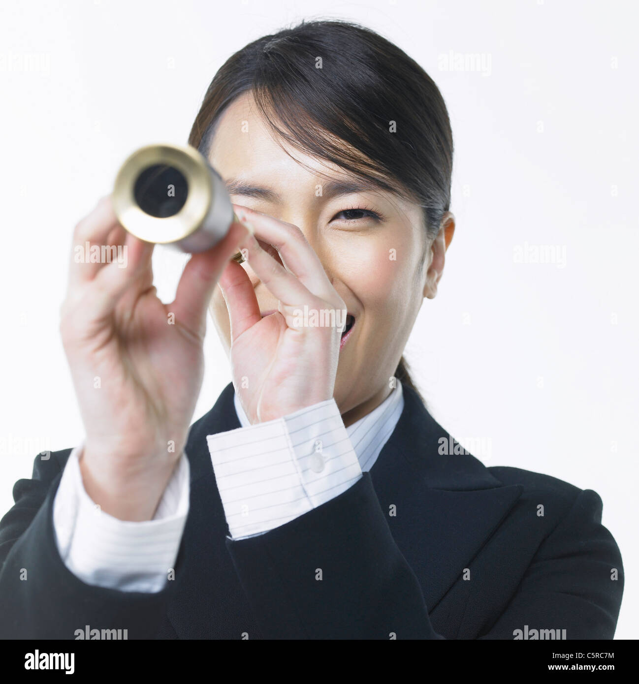 A woman looking a telescope Stock Photo - Alamy