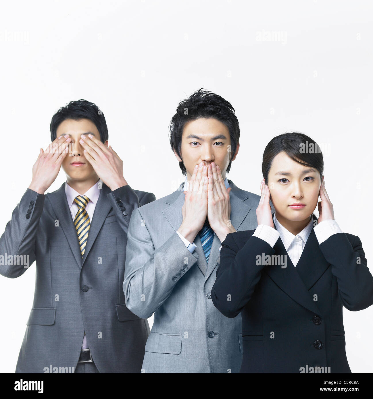 Three people posing Stock Photo - Alamy