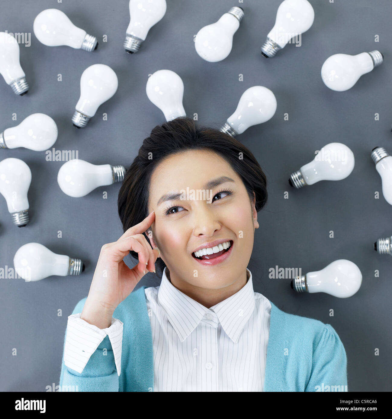 A woman with light bulbs Stock Photo - Alamy