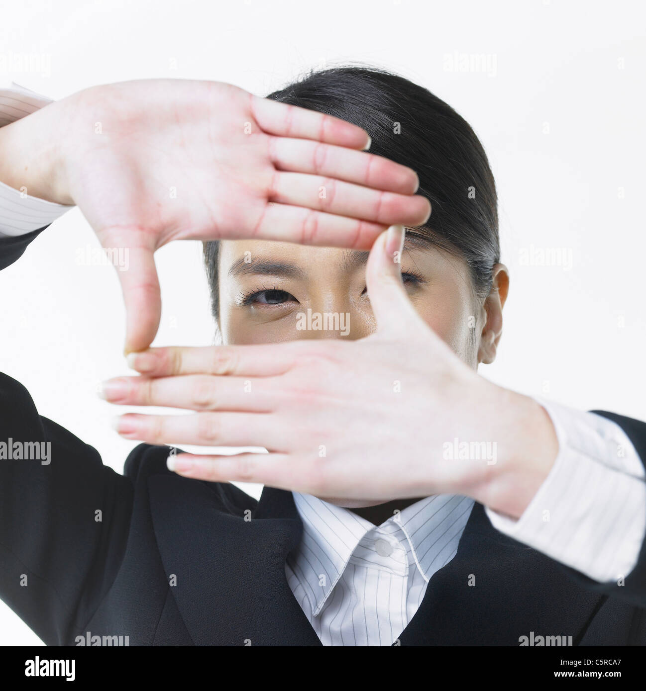 A woman making square with her hands Stock Photo - Alamy