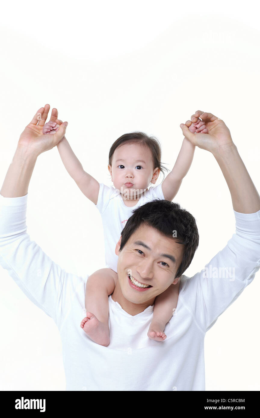 Father giving his baby piggy back Stock Photo - Alamy