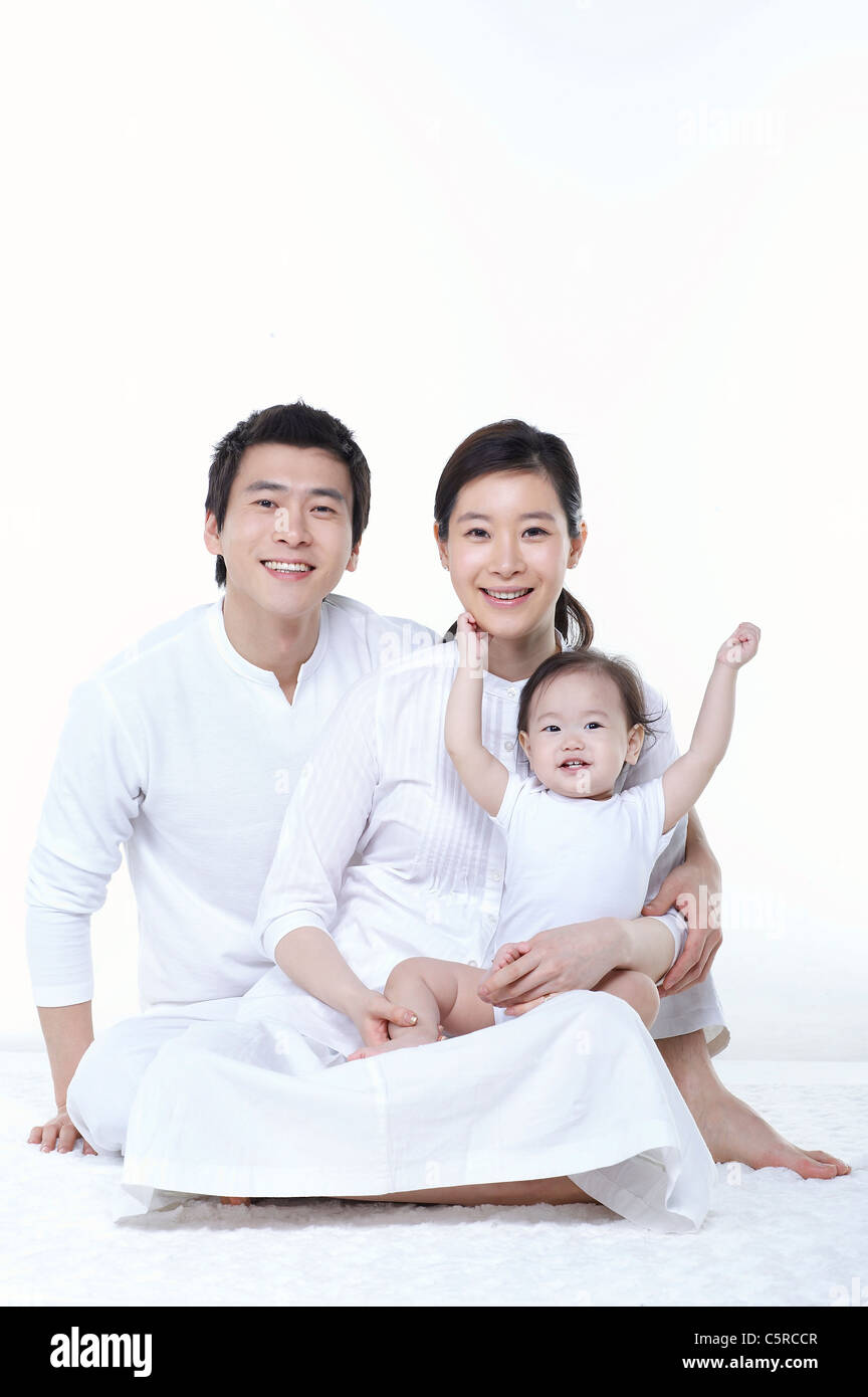 A family sitting together Stock Photo - Alamy