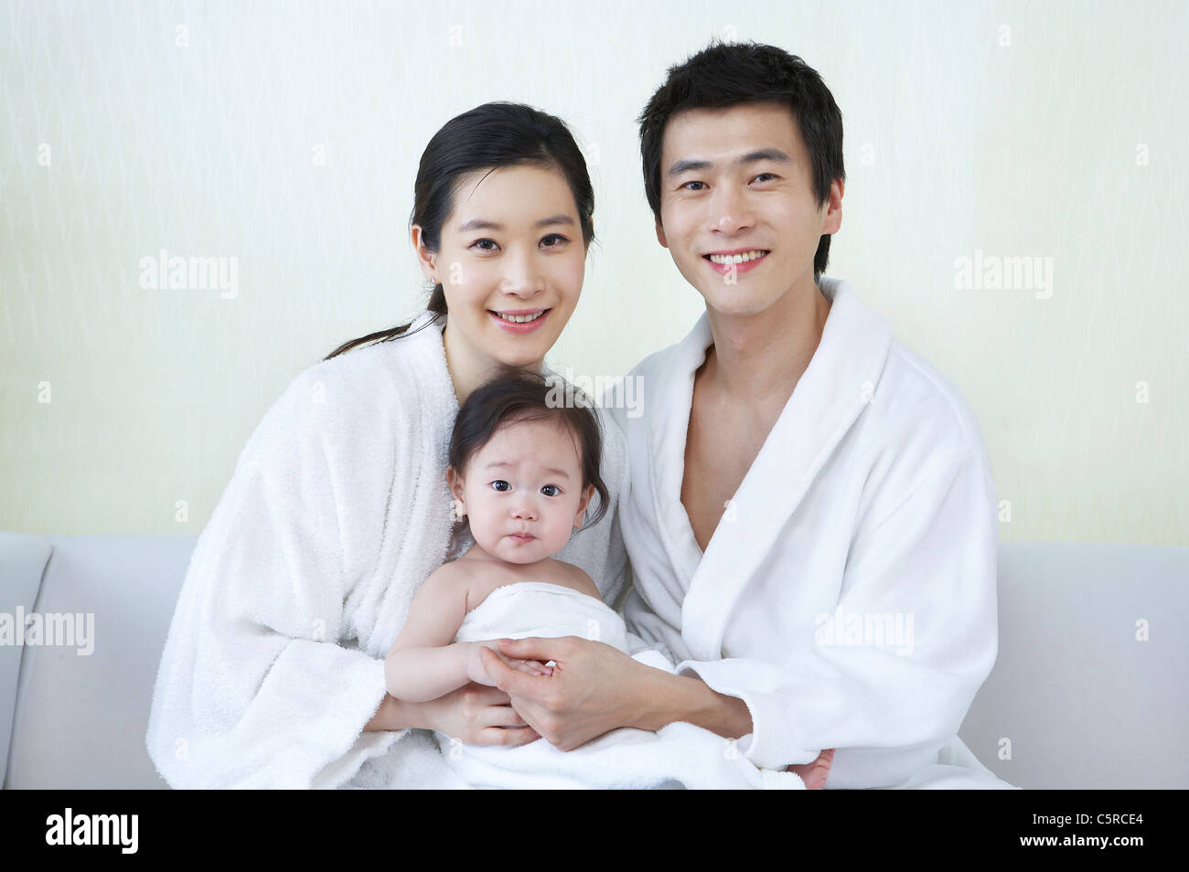 A family with bathrobe Stock Photo - Alamy