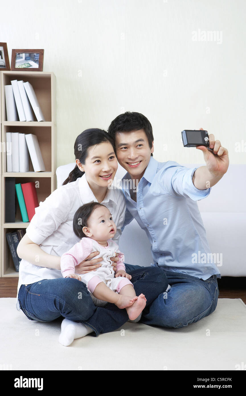 A family taking a picture Stock Photo - Alamy
