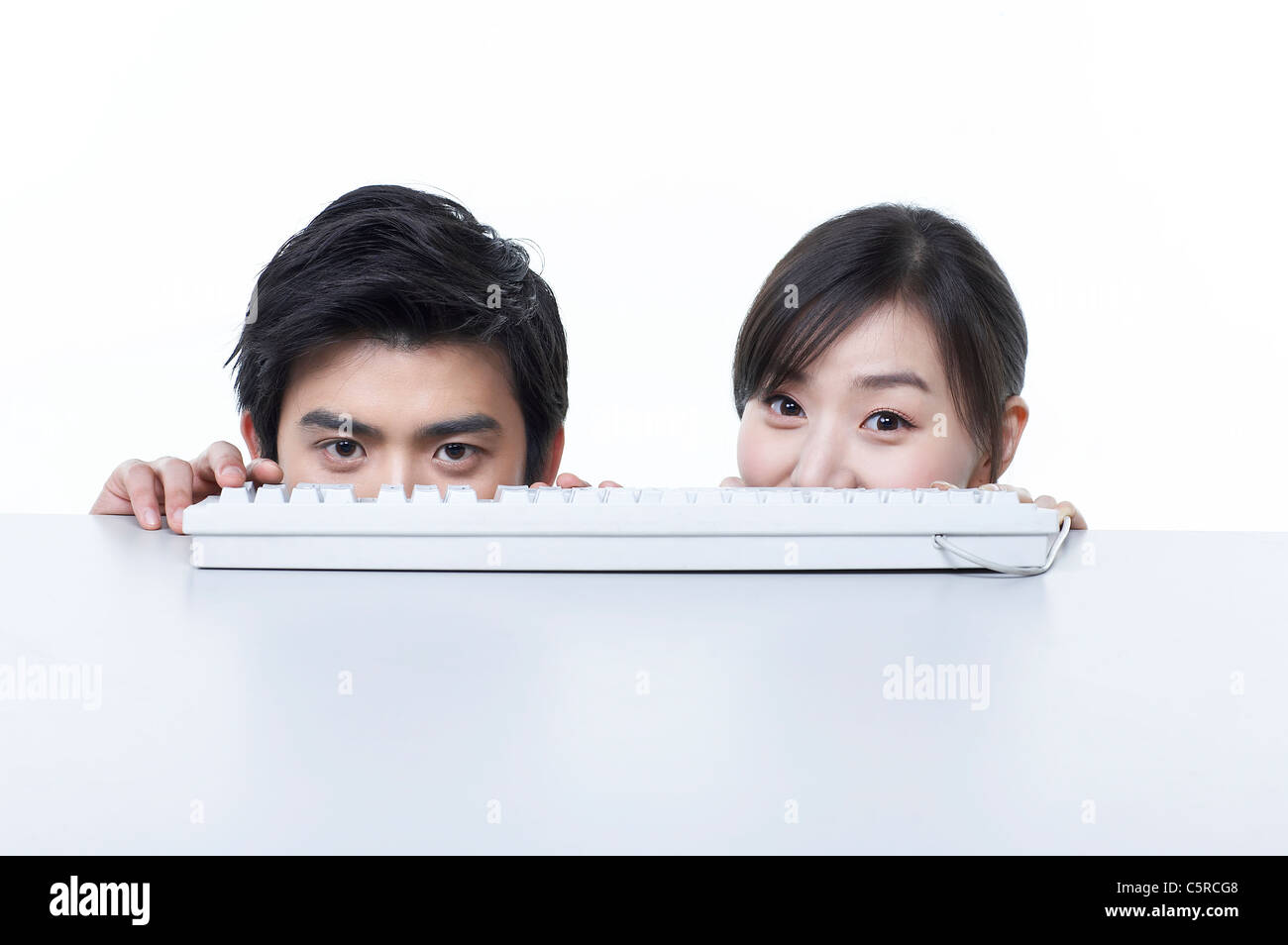 Hiding face behind fingers hi-res stock photography and images - Alamy