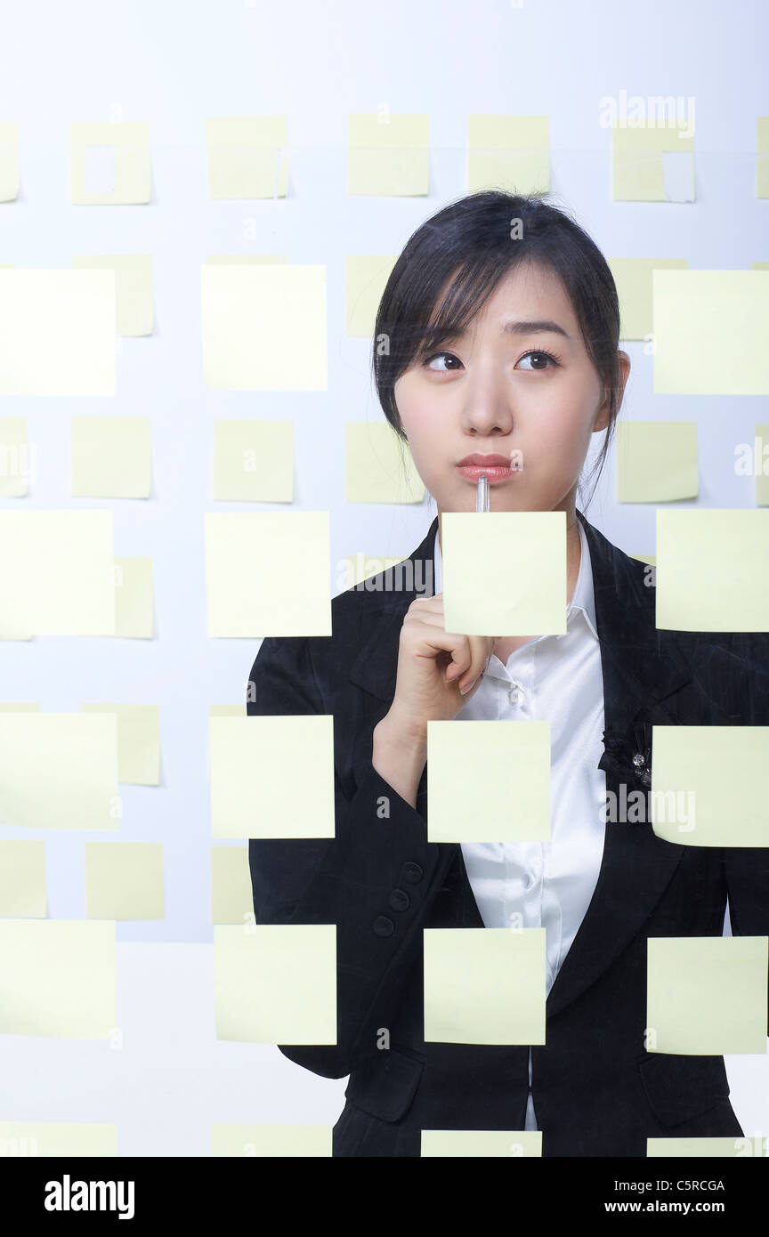 A business woman with many post its Stock Photo - Alamy