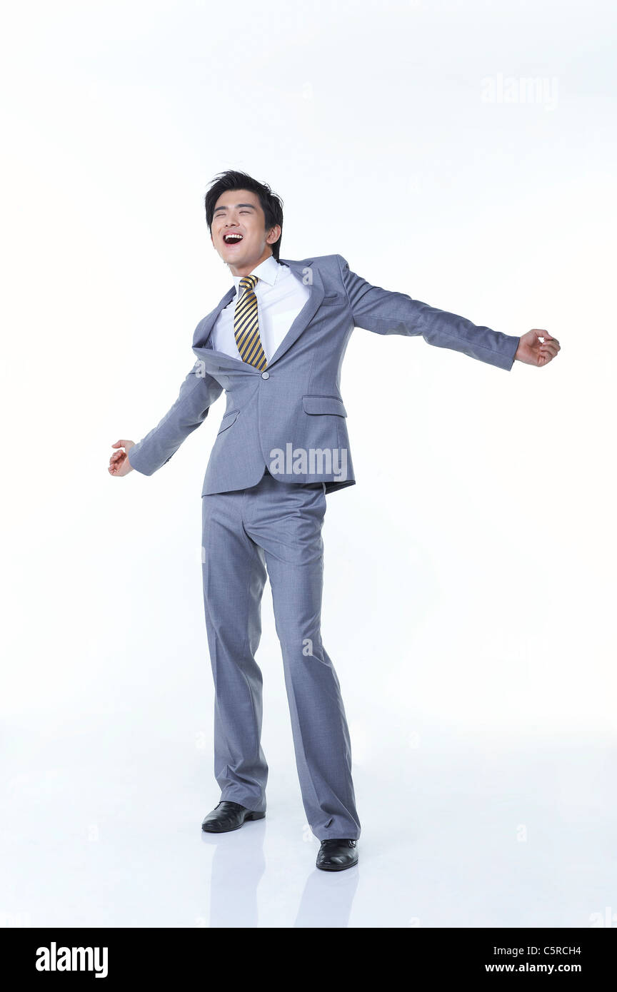 A business man stretching himself Stock Photo - Alamy