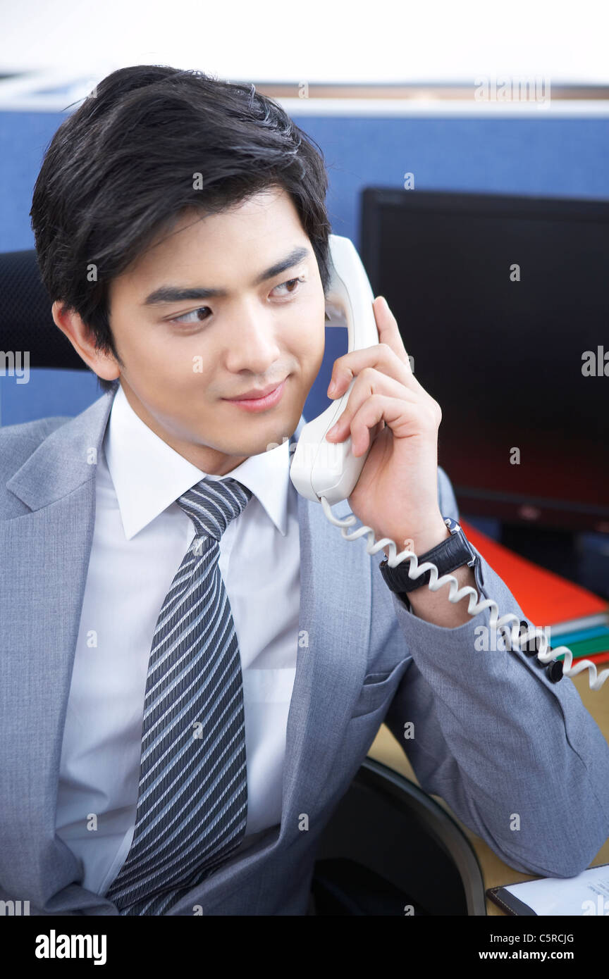 A business man taking a phone call Stock Photo - Alamy