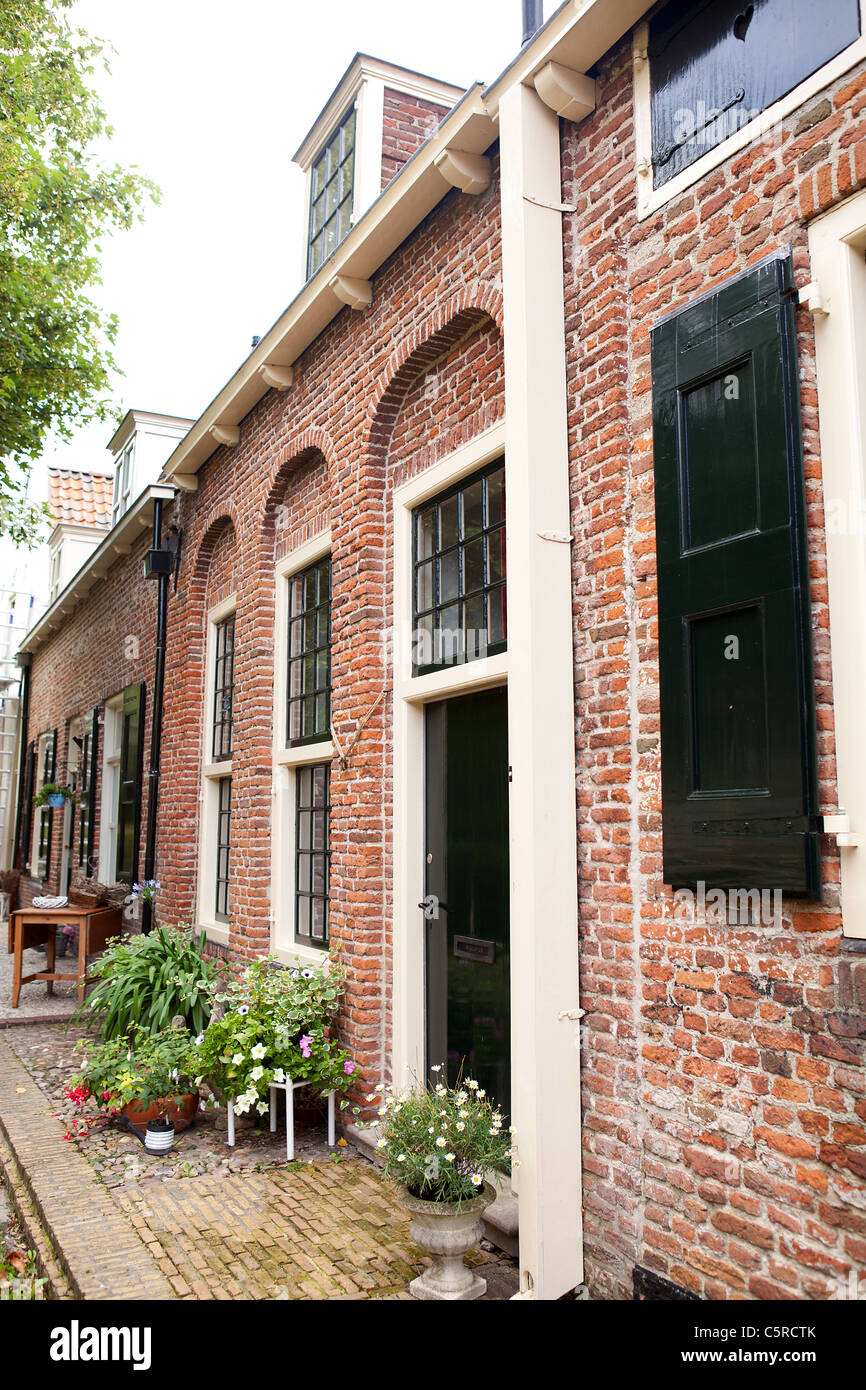 Street with typical Dutch houses in a row Stock Photo - Alamy