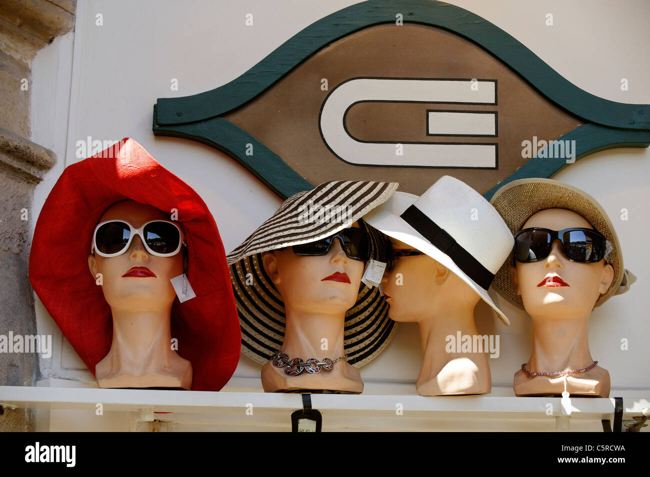 Hats on Mannequin heads in a Paris market Stock Photo - Alamy