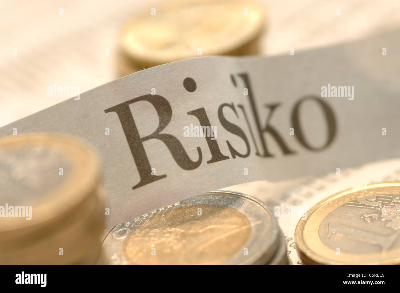 Euro coins and "risk"-note Stock Photo - Alamy