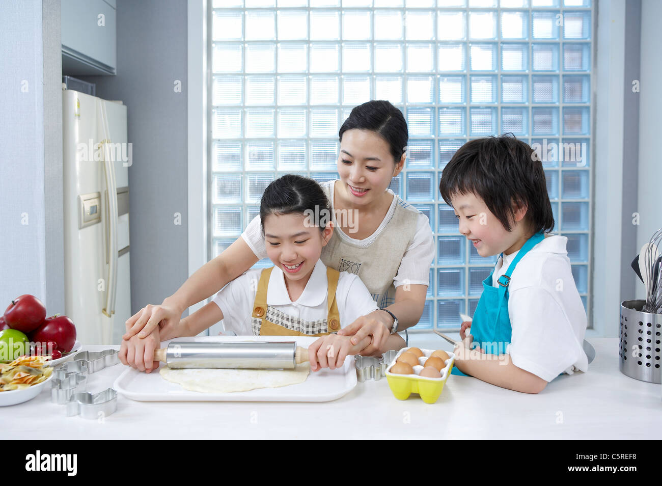 A family having a good time cooking Stock Photo - Alamy
