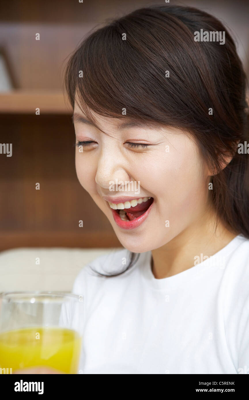 A woman drinking beverage Stock Photo - Alamy
