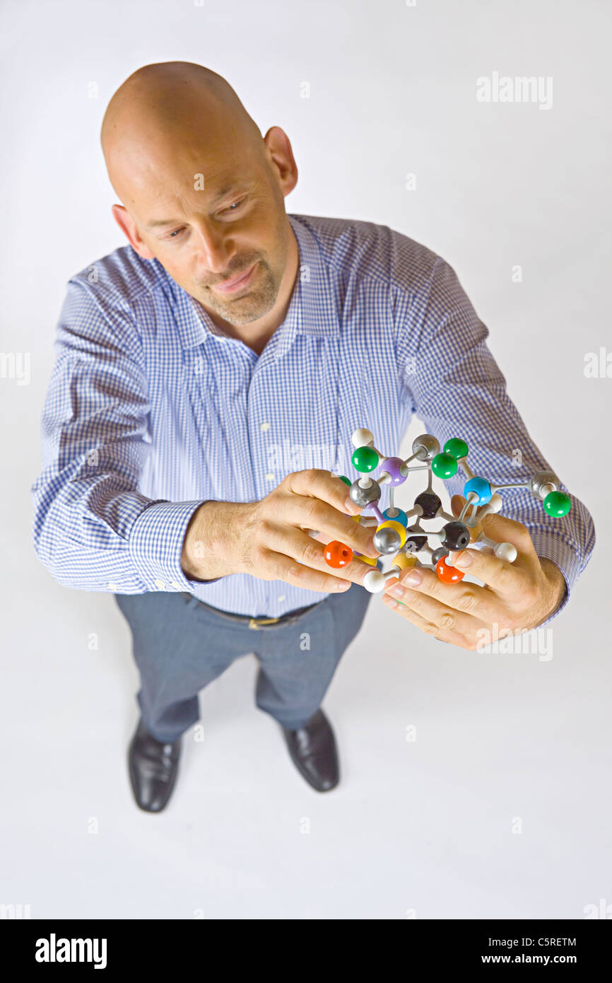 Aerial view of a man holding a molecular structure Stock Photo - Alamy