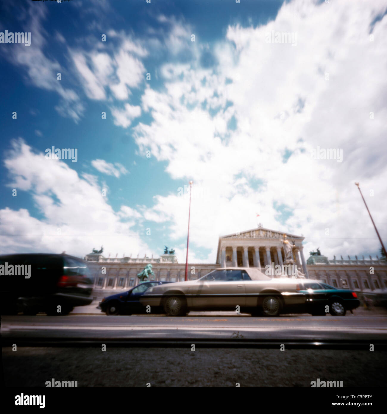 Austria, Vienna, Parliament Building, car traffic in the foreground ...
