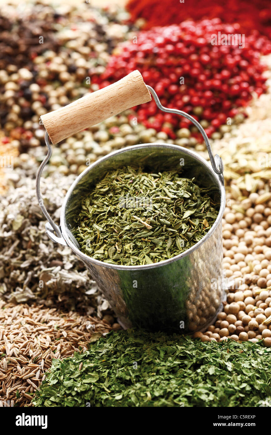 A selection of spices, in foreground dried sage in zinc bucket, close ...