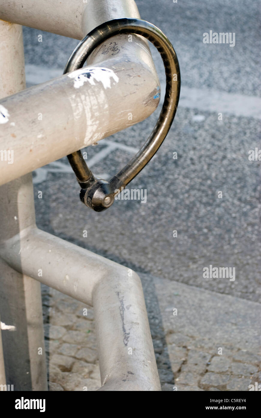 Bike lock on railing, Close up Stock Photo - Alamy