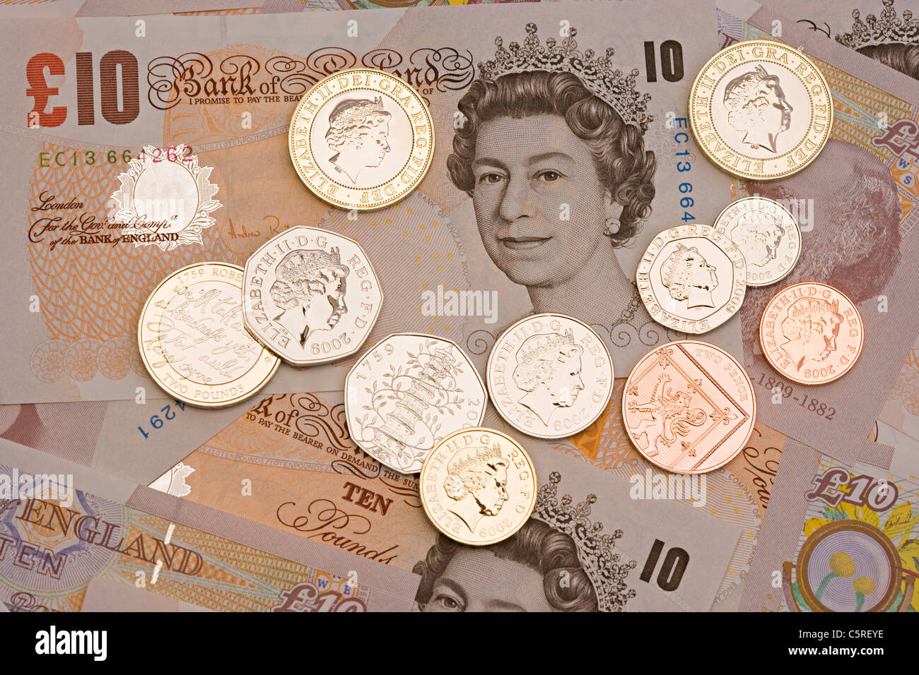 new and unused fan of UK Sterling ten pound bank notes with mint coins ...