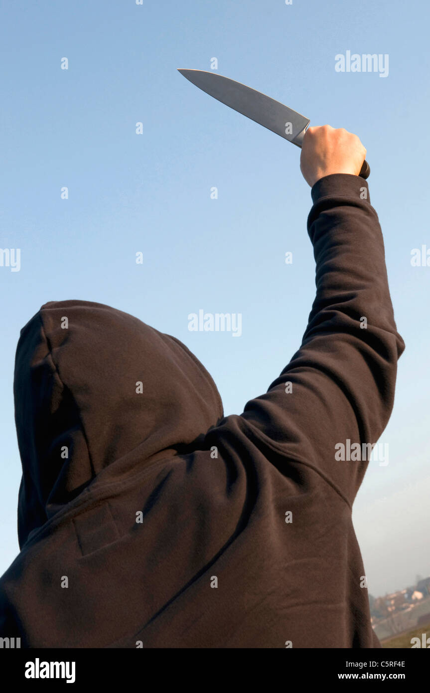 Germany, Person holding knife Stock Photo - Alamy