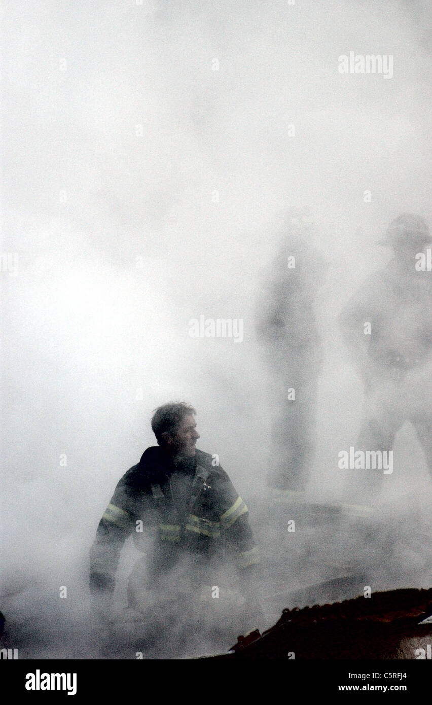 Fireman walks through the smoke at ground zero, World Trade Center ...