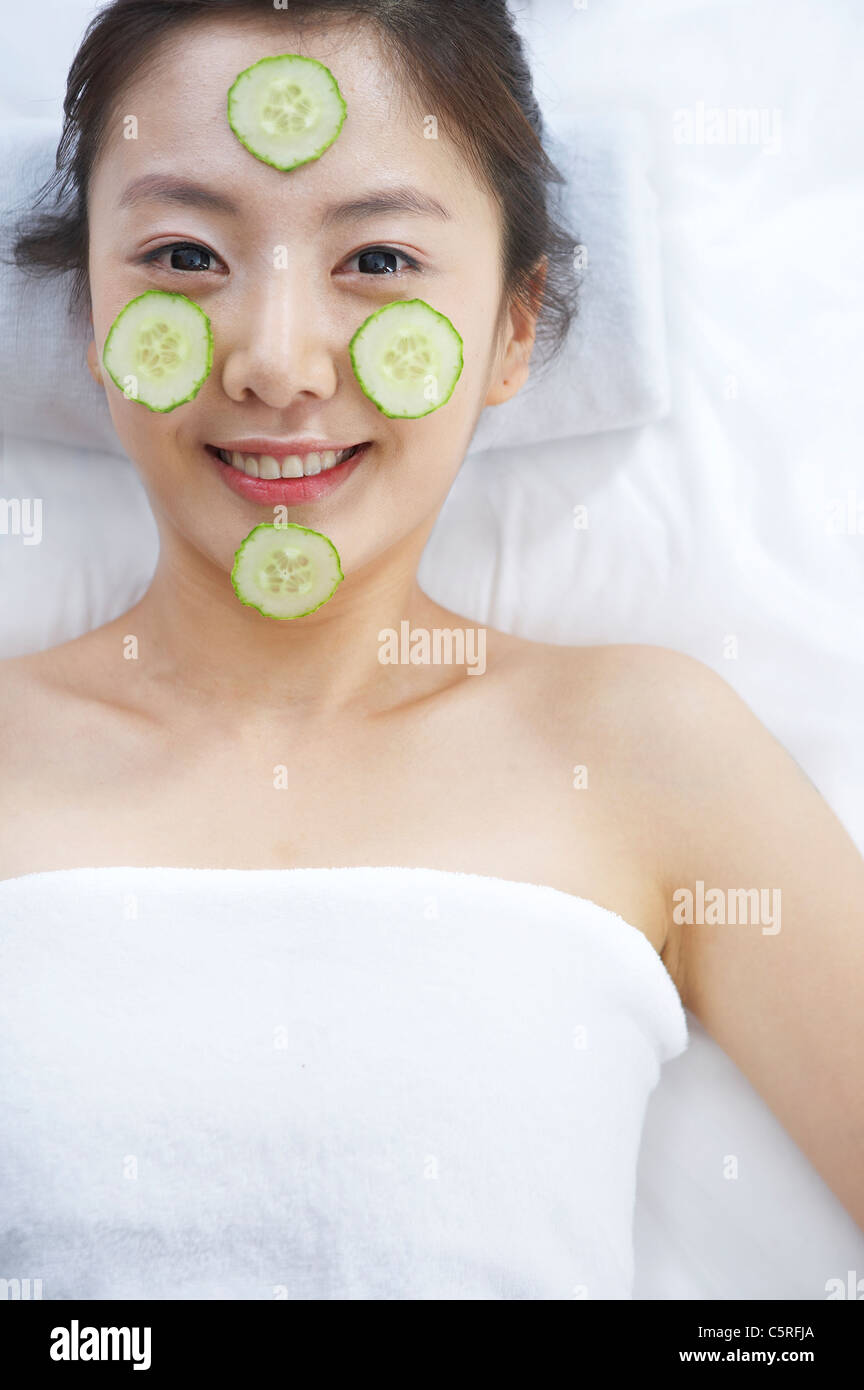 A women getting cucumber mask Stock Photo - Alamy