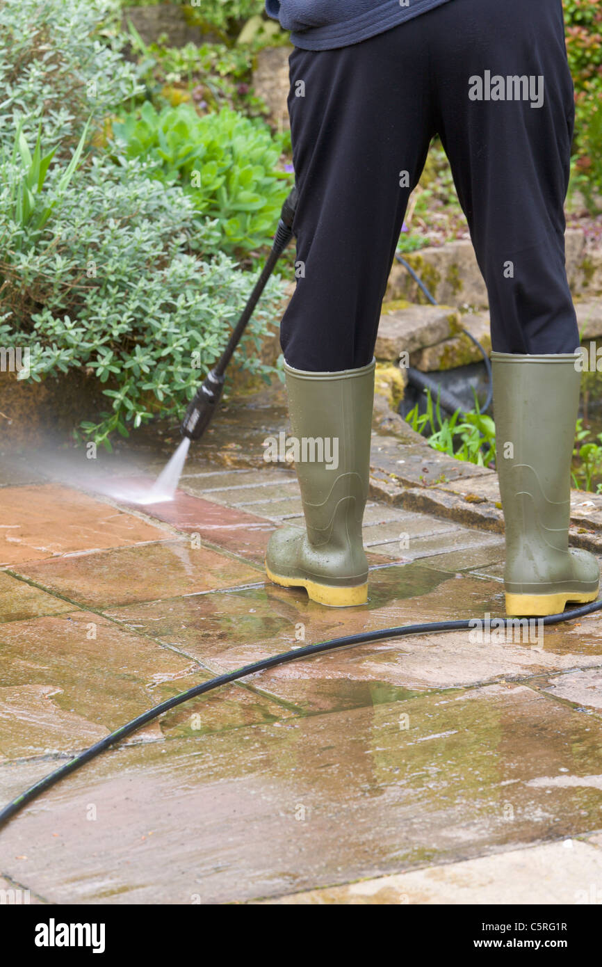 Jet washing a patio Stock Photo - Alamy