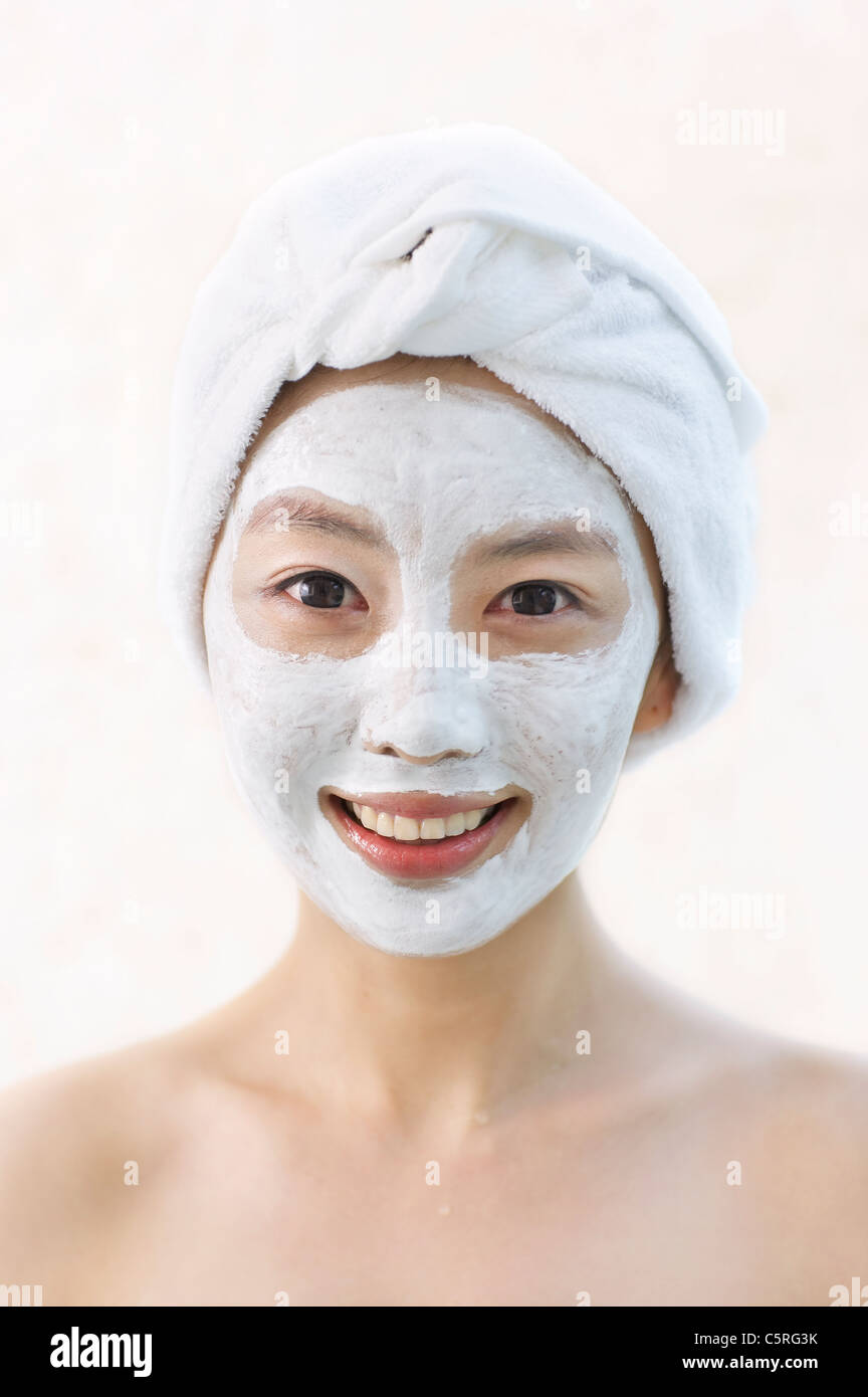 A woman applying facial pack Stock Photo - Alamy