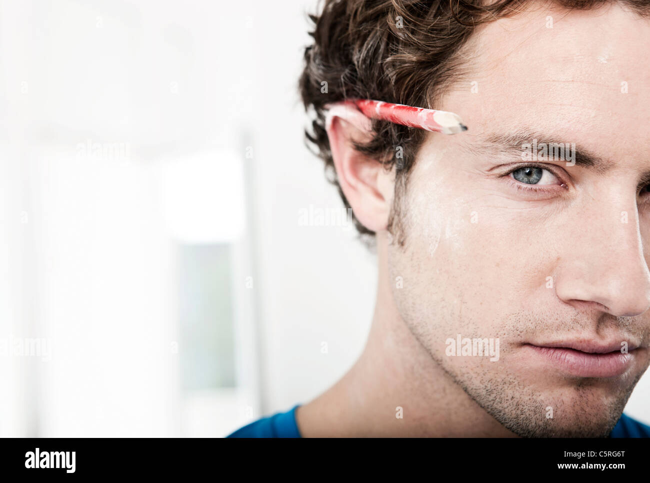 Pencil behind ear hi-res stock photography and images - Alamy