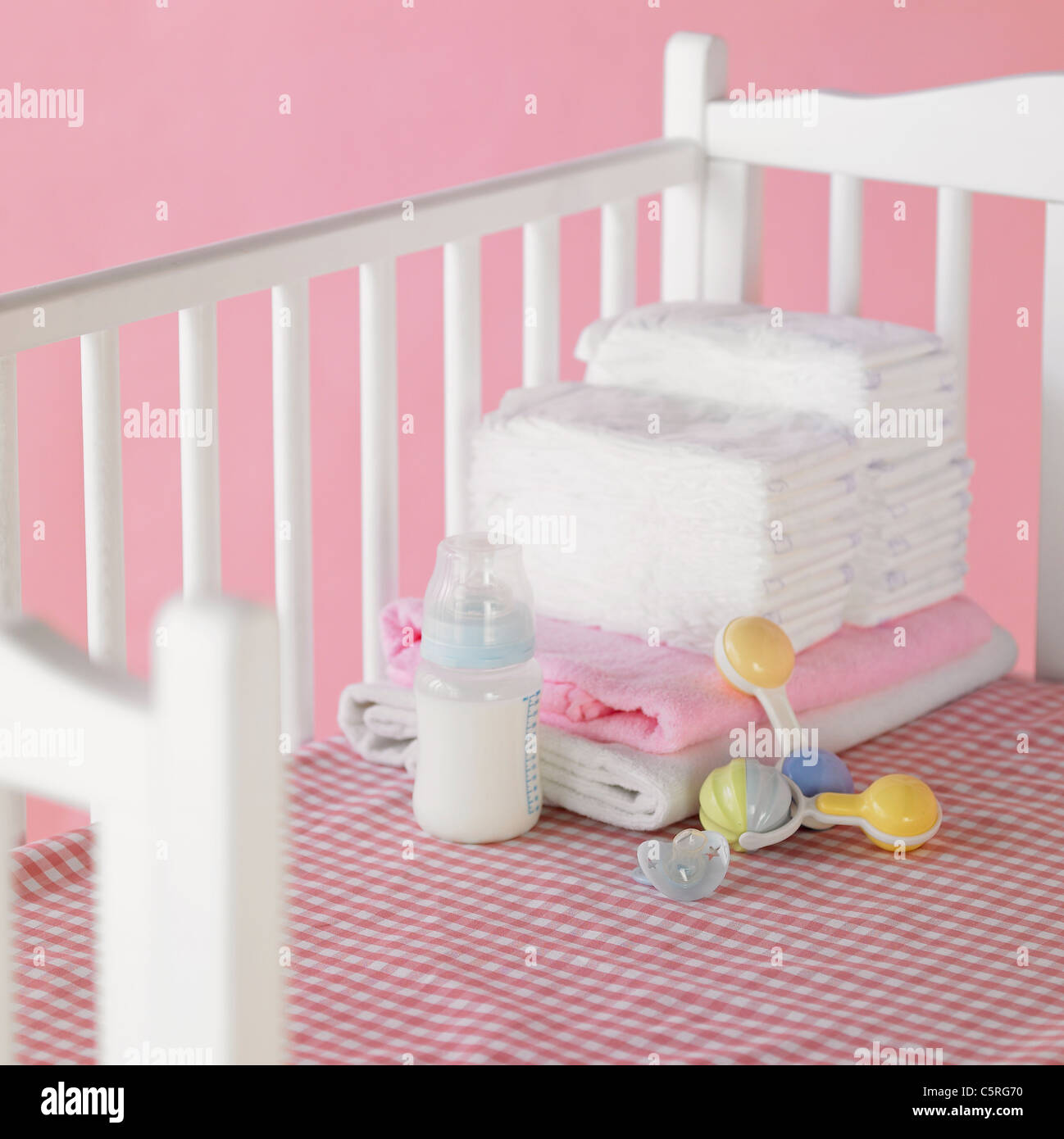 A white cradle and baby's supplies Stock Photo - Alamy