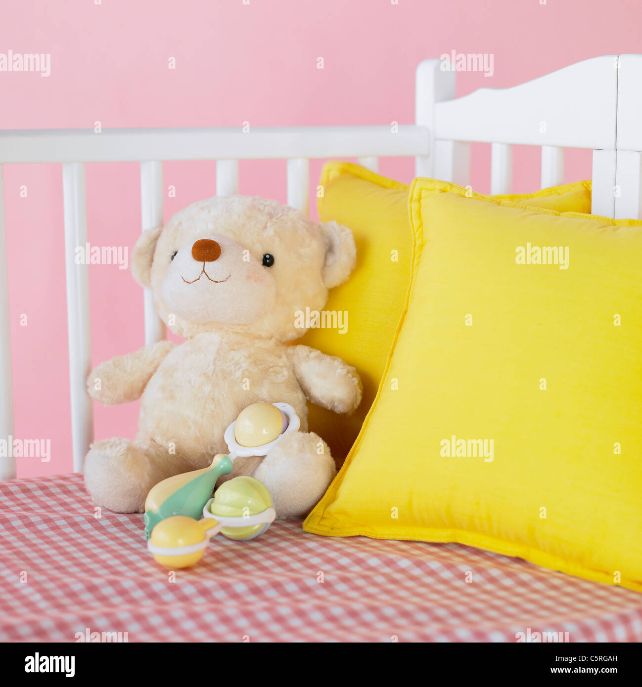A doll, rattles and sofa on a cradle Stock Photo - Alamy