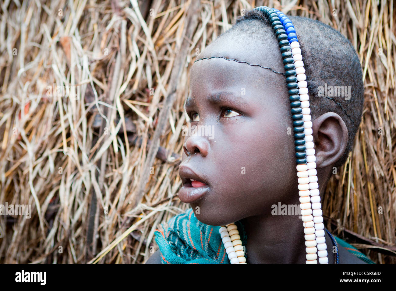 Portrait of a child from the Mursi tribe at a village in Mago National ...