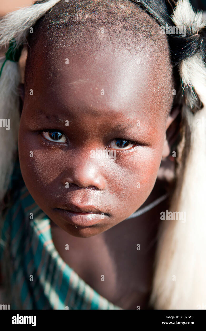 Portrait of a child from the Mursi tribe at a village in Mago National ...